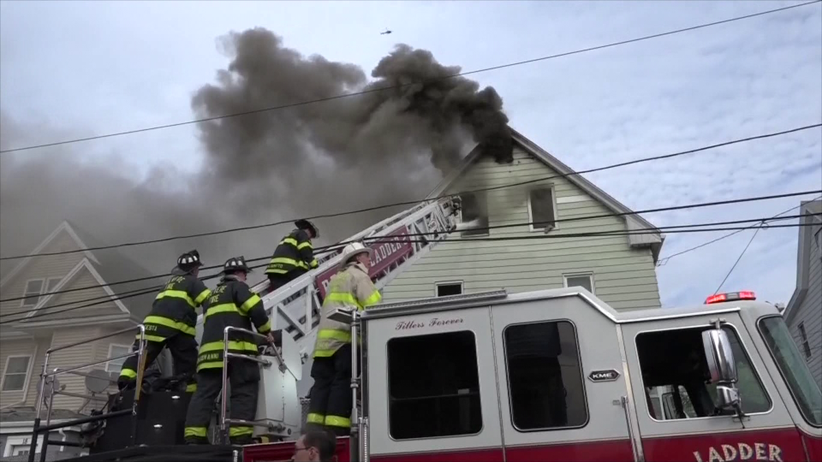 Roof caves in as firefighters battle flames in Revere home