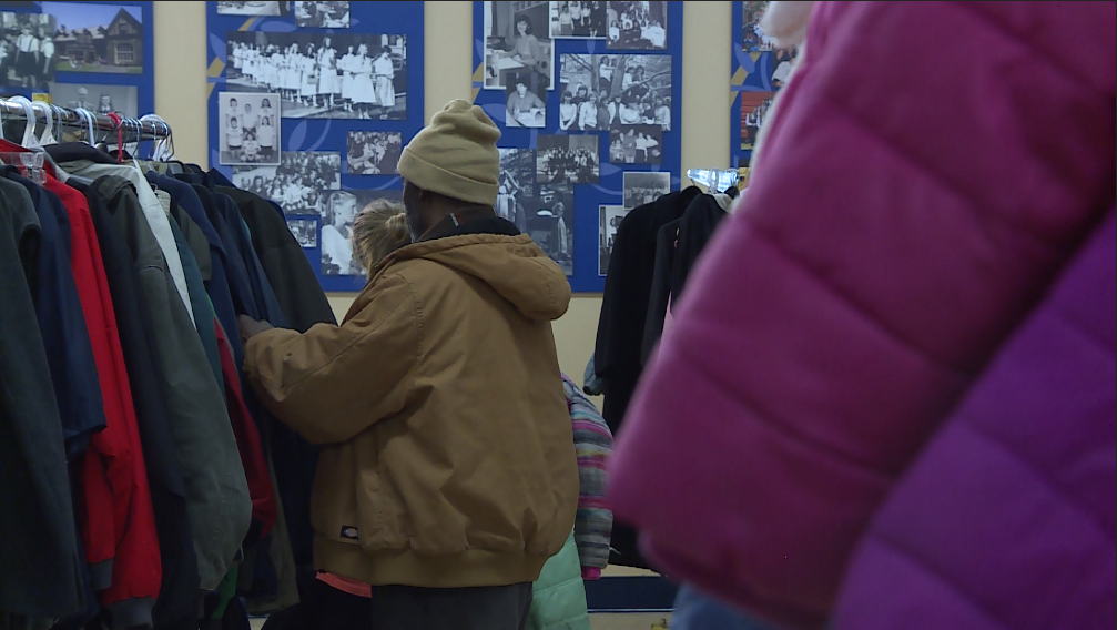 Thousands fight off the cold with the warmth of neighbor helping neighbor