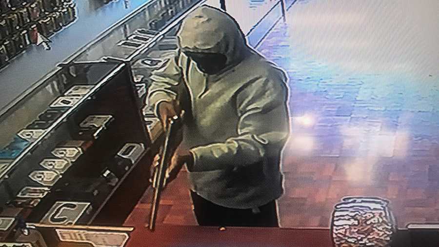 Man with long gun caught on camera stealing cellphones from Greenville ...