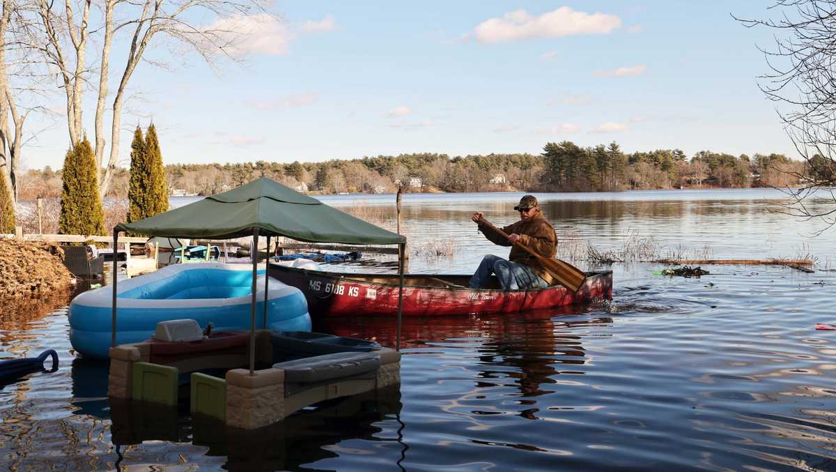 Breached dam between two ponds leads to flooding of homes, streets
