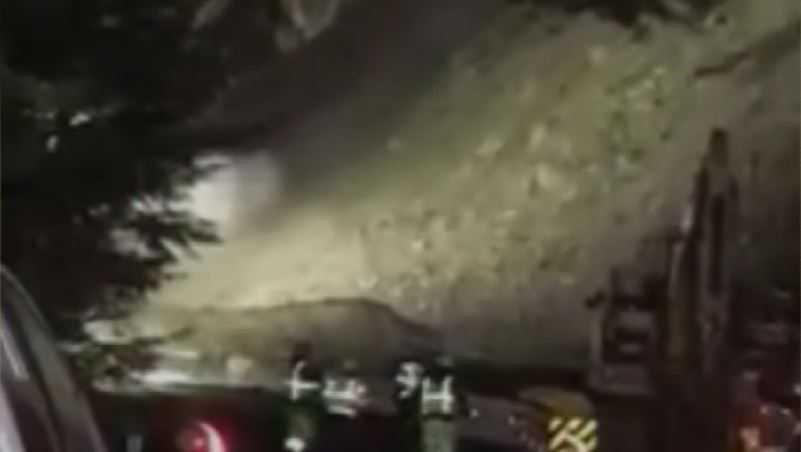 Workers rush to escape massive rock slide