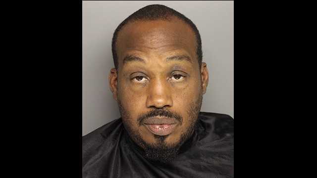 Bank robber literally caught red-handed, police say Bank robber literally caught red-handed, police say