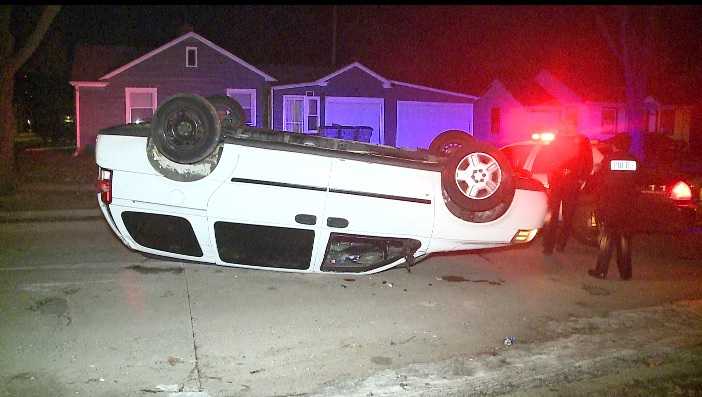 Rollover crash leaves car on roof, 2 people hospitalized