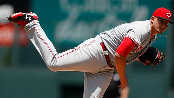 Romano gets first major league win, Reds beat Rockies 6-3