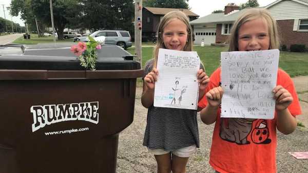 Flowers, notes of encouragement appear on Rumpke cans after worker's death
