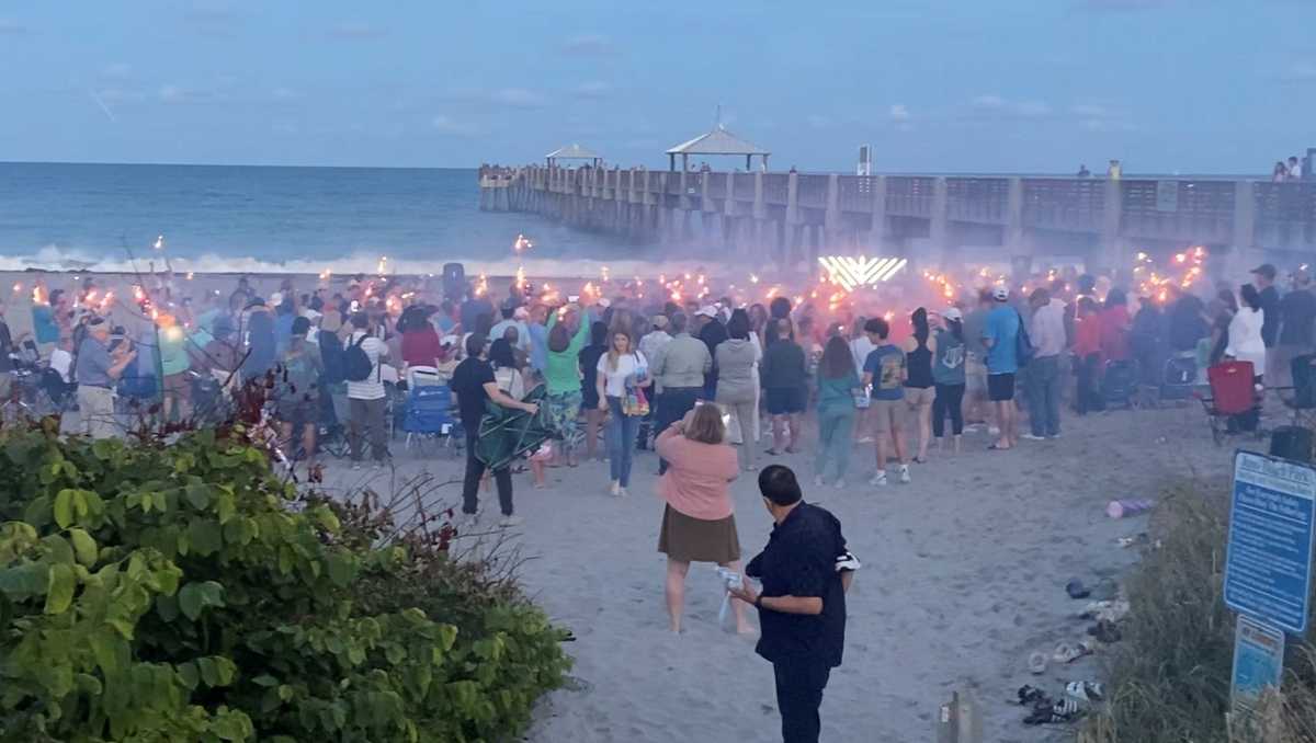 Sand menorah relit on Juno Beach