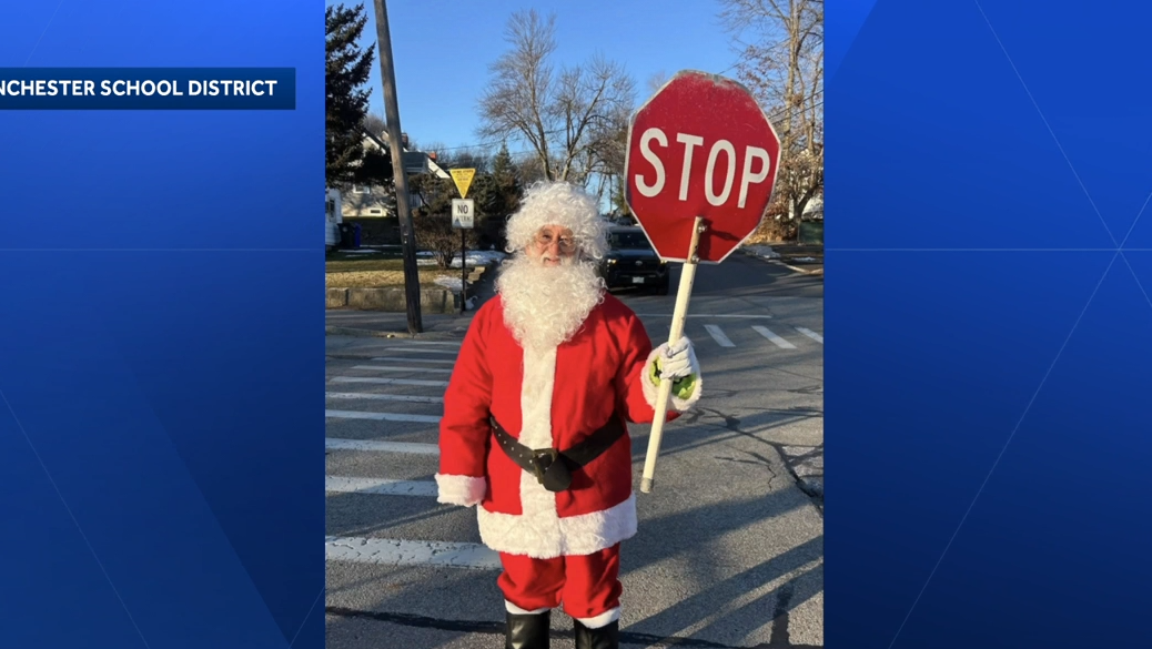Manchester crossing guard spreads holiday cheer in Santa suit