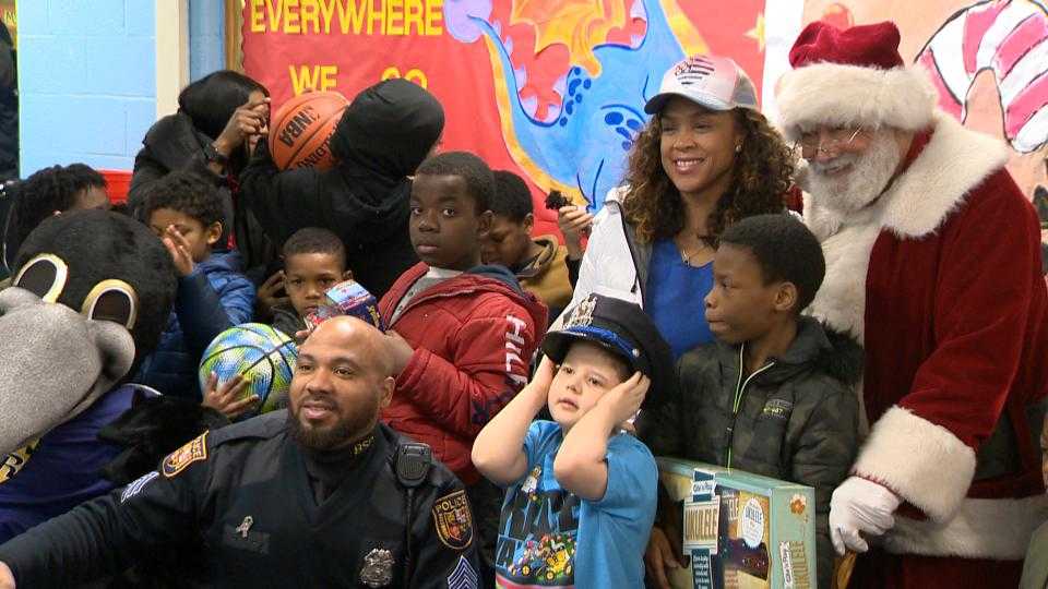 Santa Luke, Baltimore prosecutor deliver Christmas gifts to schools