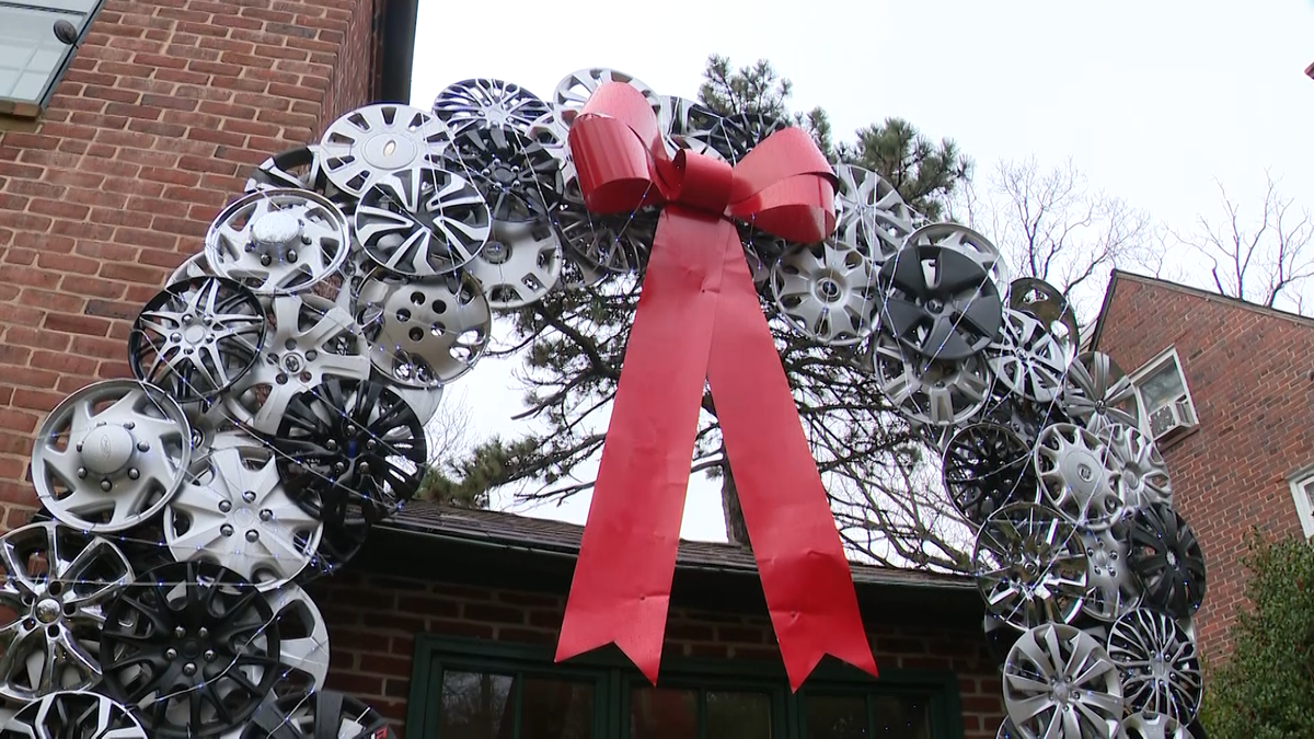 Baltimore man makes giant holiday wreaths with hubcaps