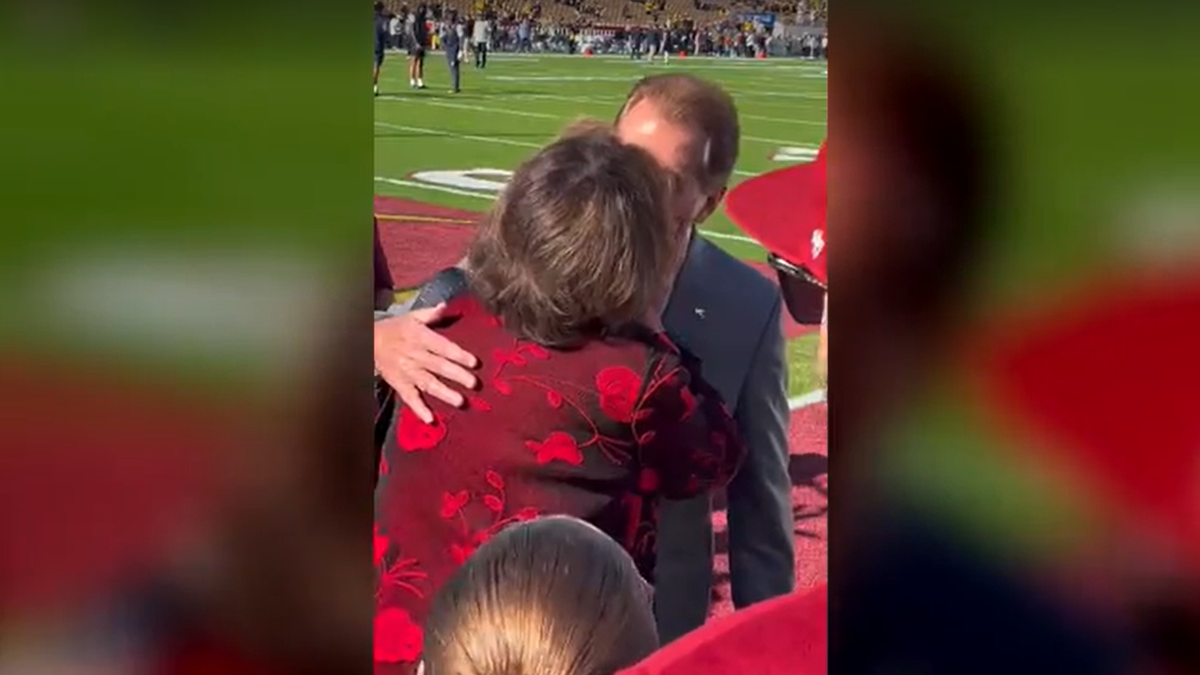 Nick Saban hugs his family before the Rose Bowl