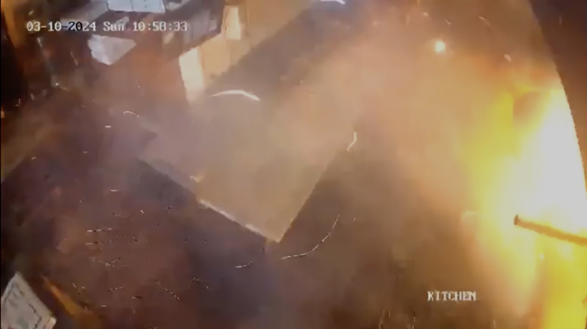 Caught on camera: Flames burst from pizza oven as man lights pilot