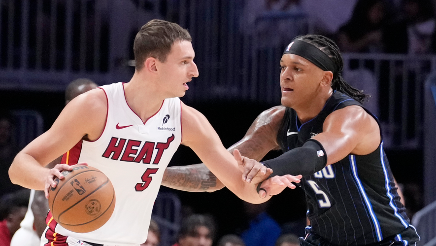 Magic roll in 2nd half to beat Heat 116-97 on opening night