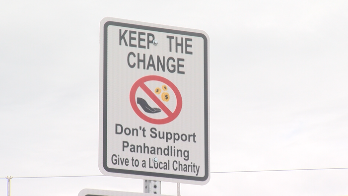 Unusual anti-panhandling sign appears at busy Collier intersection