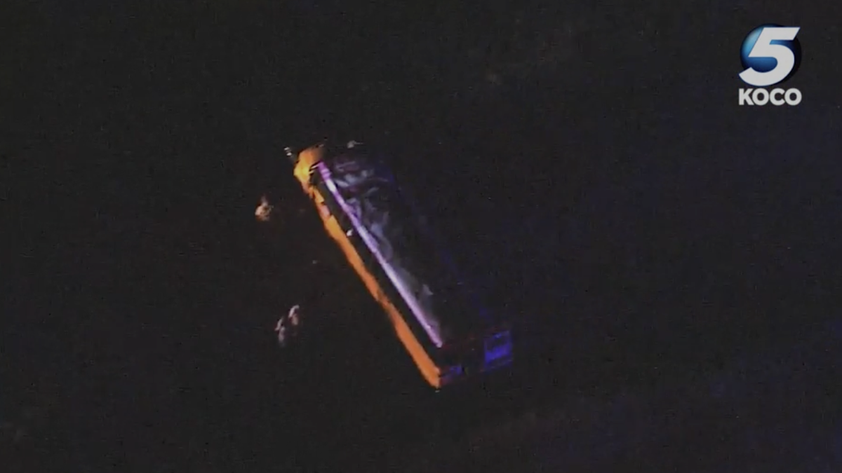 Oklahoma school bus carrying softball team rolls over