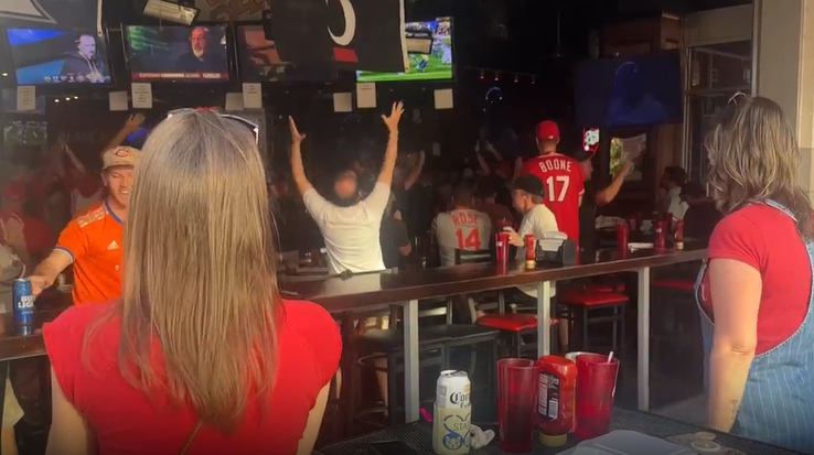 Fans celebrate as Reds clinch playoff spot in dramatic season finish