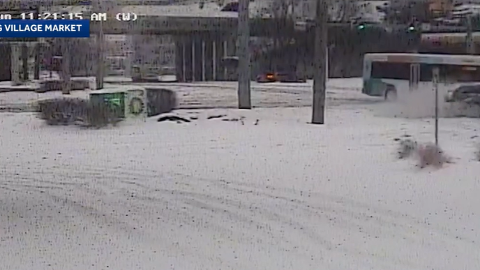 Security video shows SUV collide with Metro bus during snowstorm