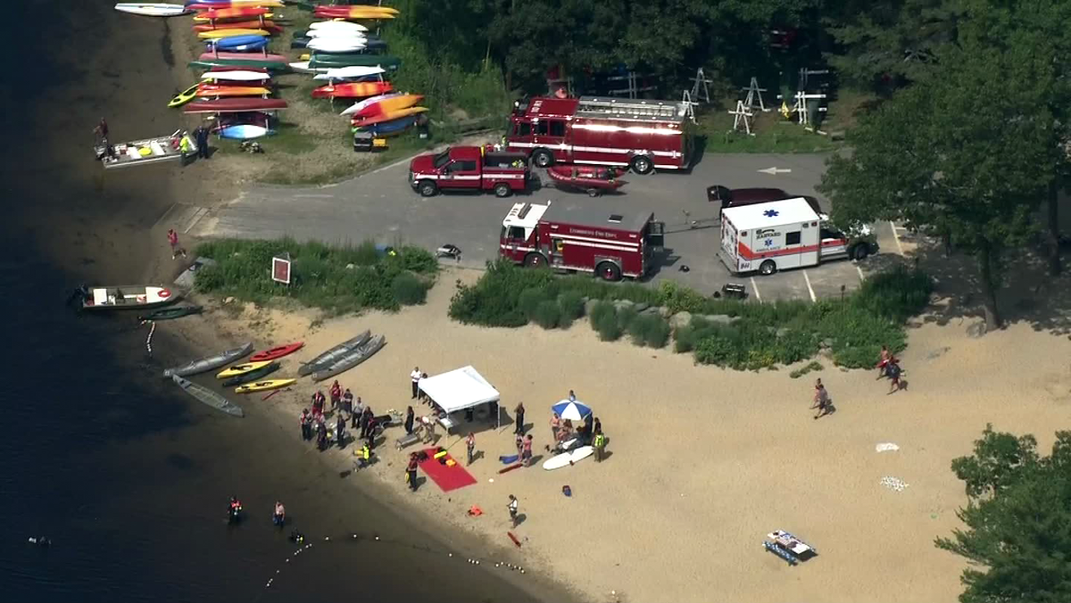 Crews search water at Harvard Town Beach on Bare Hill Pond