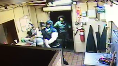 Surveillance video shows pizza shop robbery