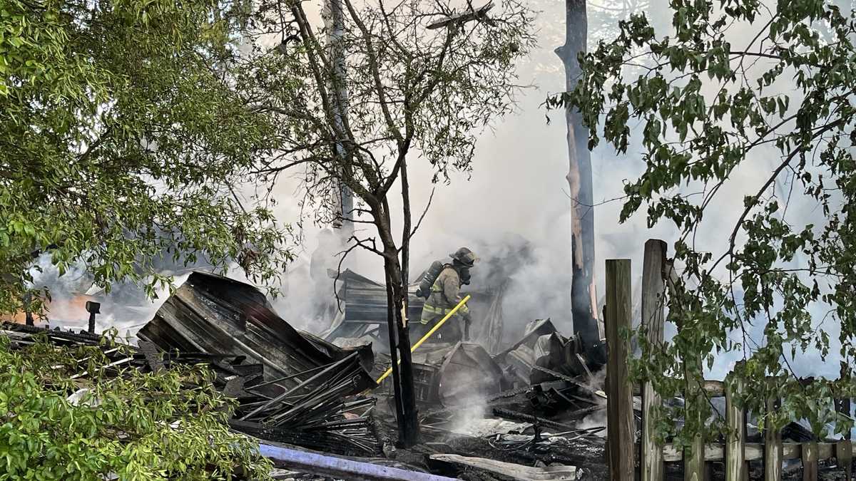 Barbecue grill causes large shed fire behind home