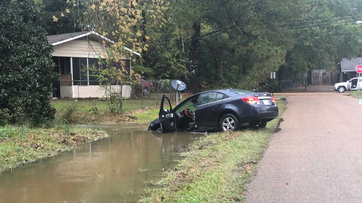 Photos: Jackson police car gets stuck in flooded ditch