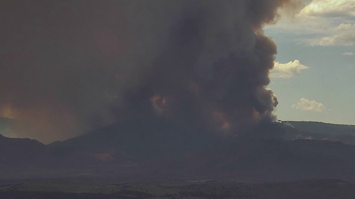 Evacuation orders remain in place as crews battle large wildfire in ...