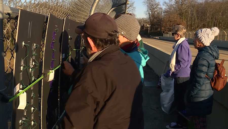Birmingham group protests ICE actions with highway sign