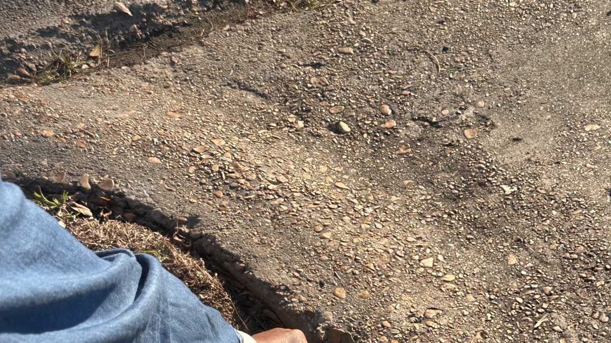 Woman finds 7 foot-deep sinkhole in her yard