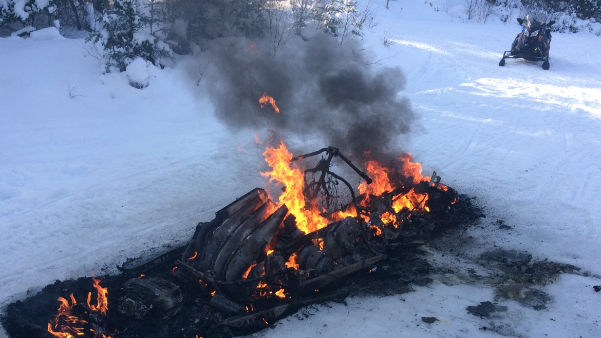Massachusetts man walks away unharmed from burning snowmobile