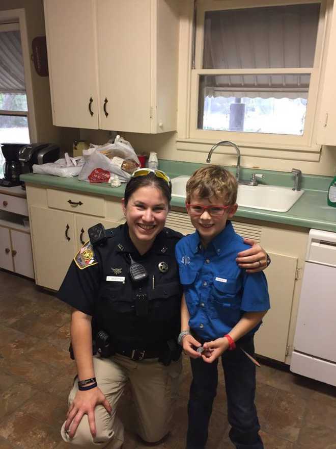 Snake crawls out of toilet, deputy comes to rescue