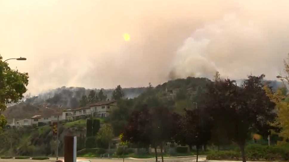 Wildfire besiege California city reeling from mass shooting