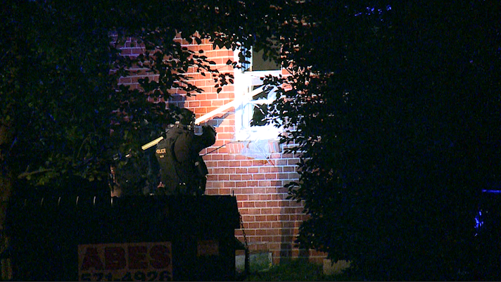 Police standoff initiated after argument between roommates turns violent