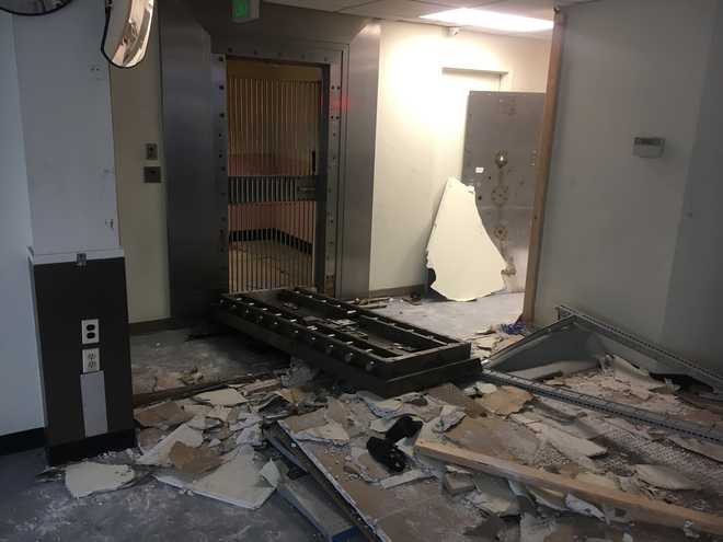 Crews extricate man stuck under steel door at supermarket Crews extricate man stuck under steel door at supermarket