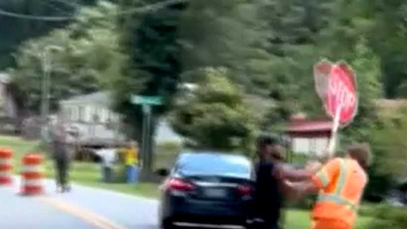 Video shows traffic flagger sucker-punched in construction zone