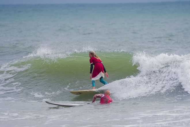 Surfing Santas brave cold on Christmas Eve for annual Cocoa Beach event