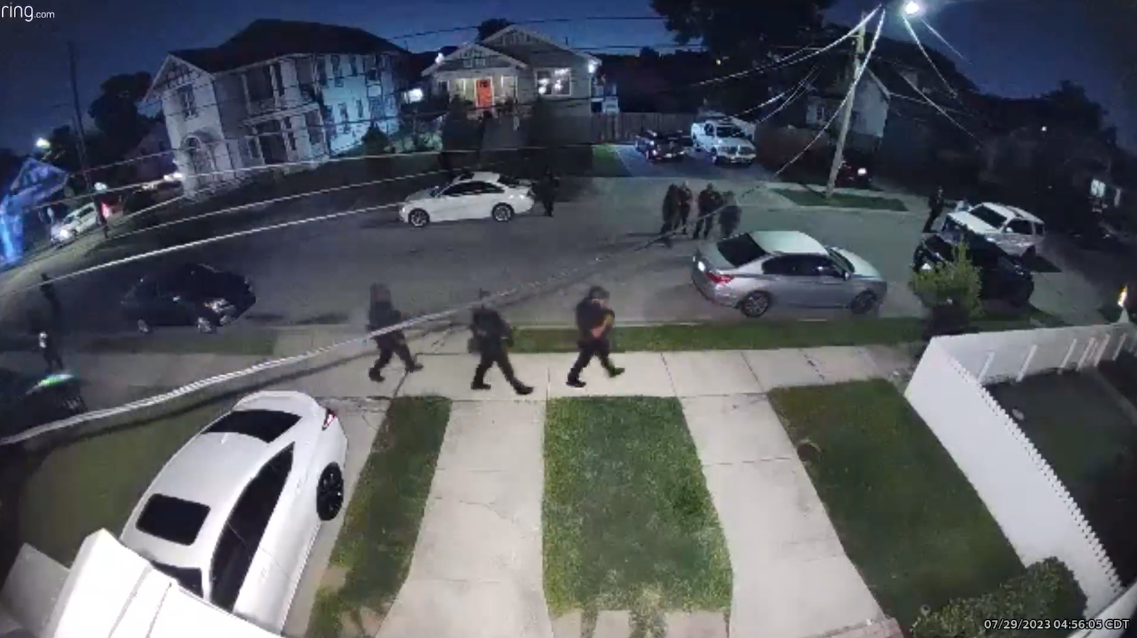 Surveillance video moments police search suspects shot at officer