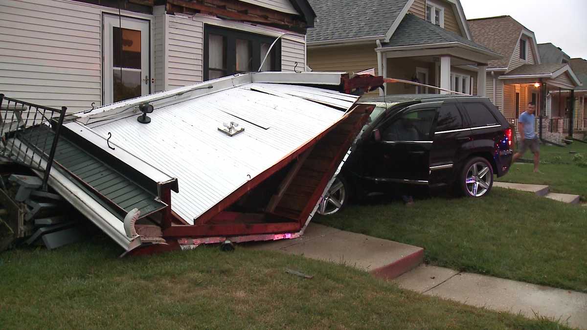 SUV slams into home causing porch to collapse