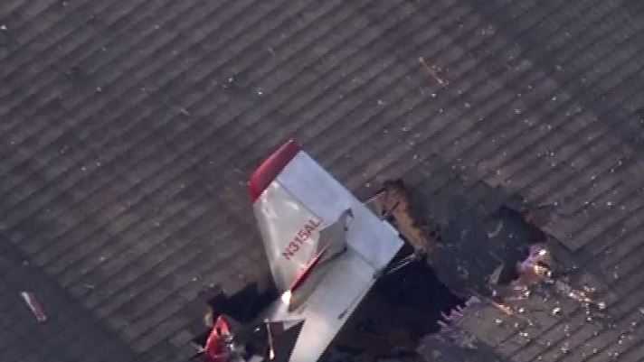 Plane crashes into condo building, killing pilot