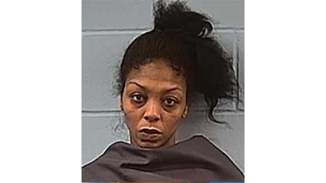 Man shot to death behind restaurant, woman arrested