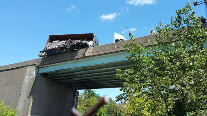 TARENTUM BRIDGE: Trailer leaning over side of Tarentum Bridge after ...