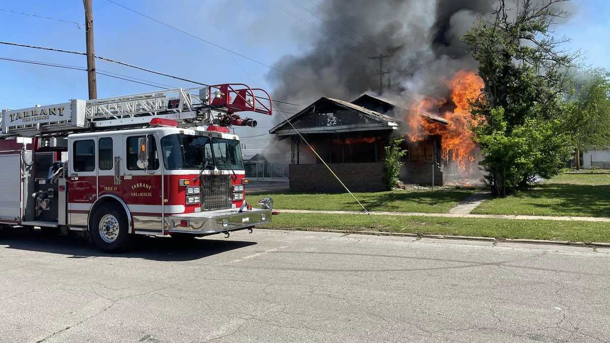 Flames visible as emergency crews work to put out Tarrant house fire