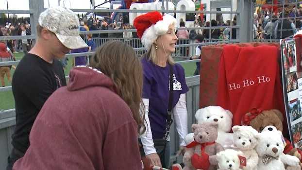 Volunteers collect teddy bears for kids in need at the Lou City game in ...