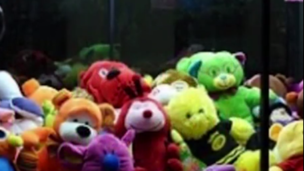 Boy gets stuck inside toy claw machine