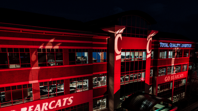 TQL headquarters lights up in red to support UC Bearcats