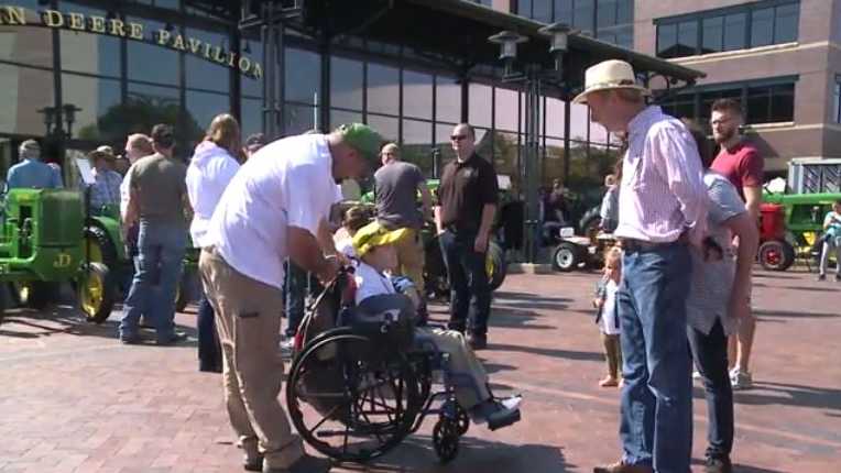 10-year-old boy with cancer leads tractor parade as grand marshal