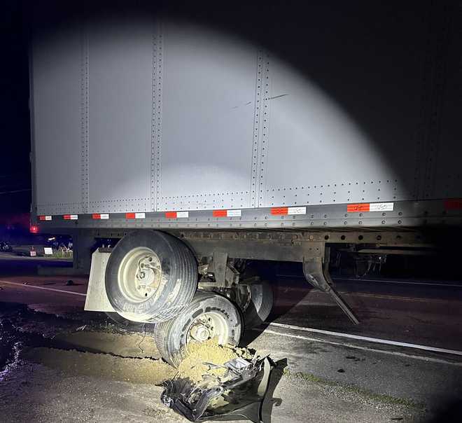 Car ends up under tractor trailer in Gray crash, driver escapes