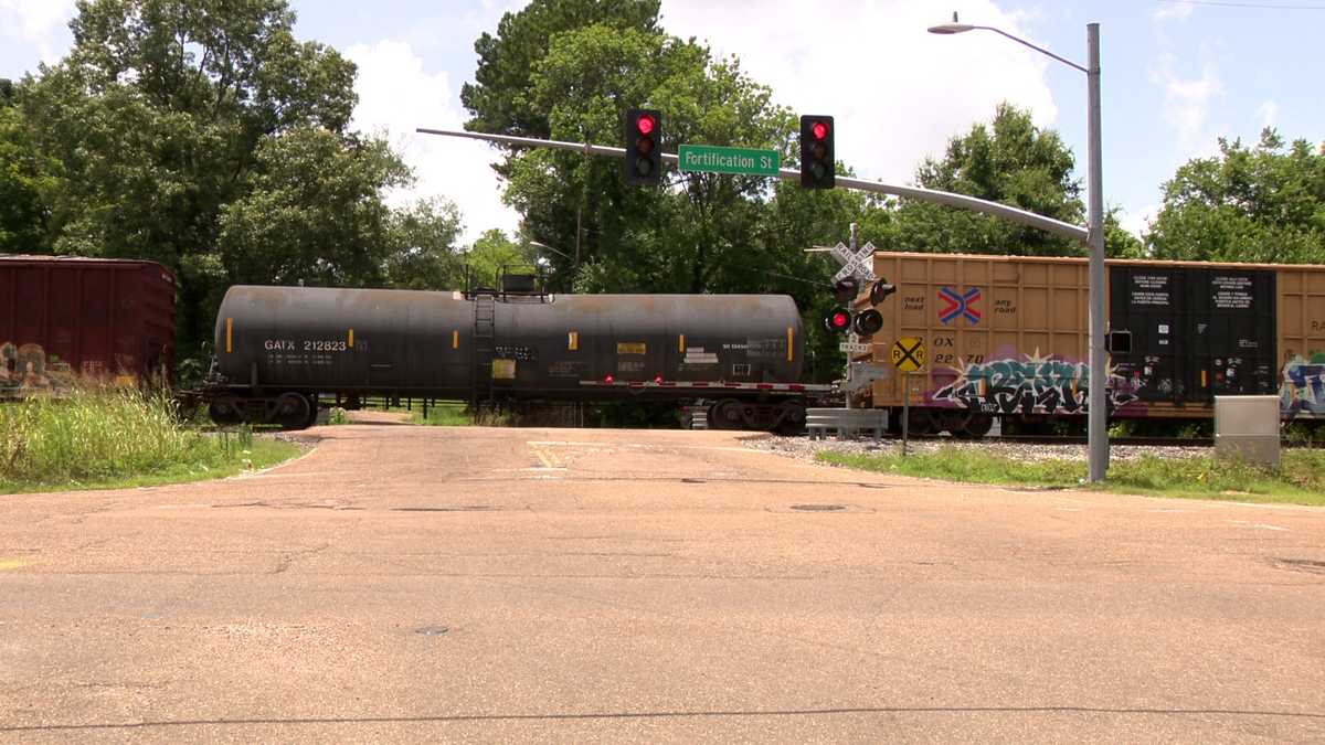 Train cars blocking neighborhood railroad crossing