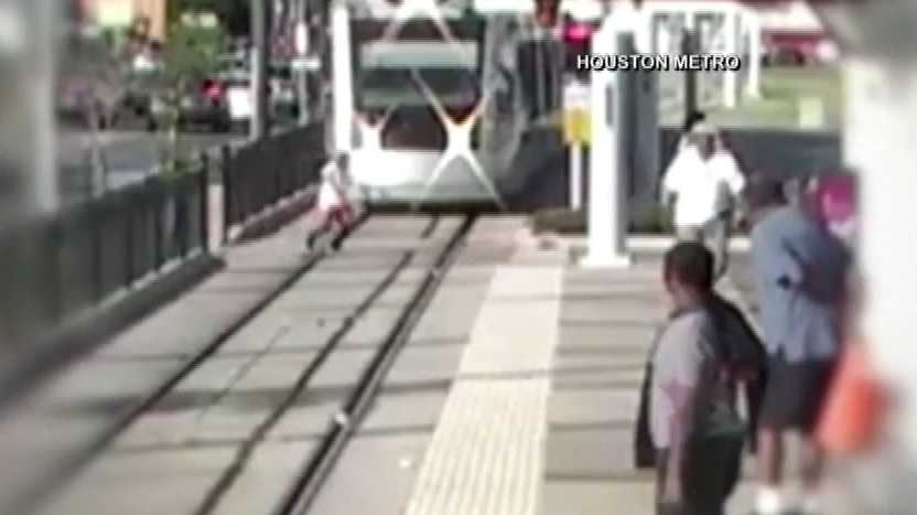 Video captures life-threatening close call of boy crossing train track