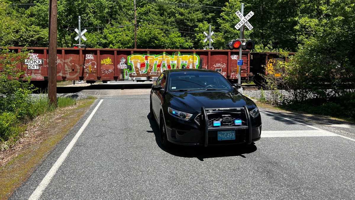 Train stuck on tracks causes road closure in Sherborn, Mass.