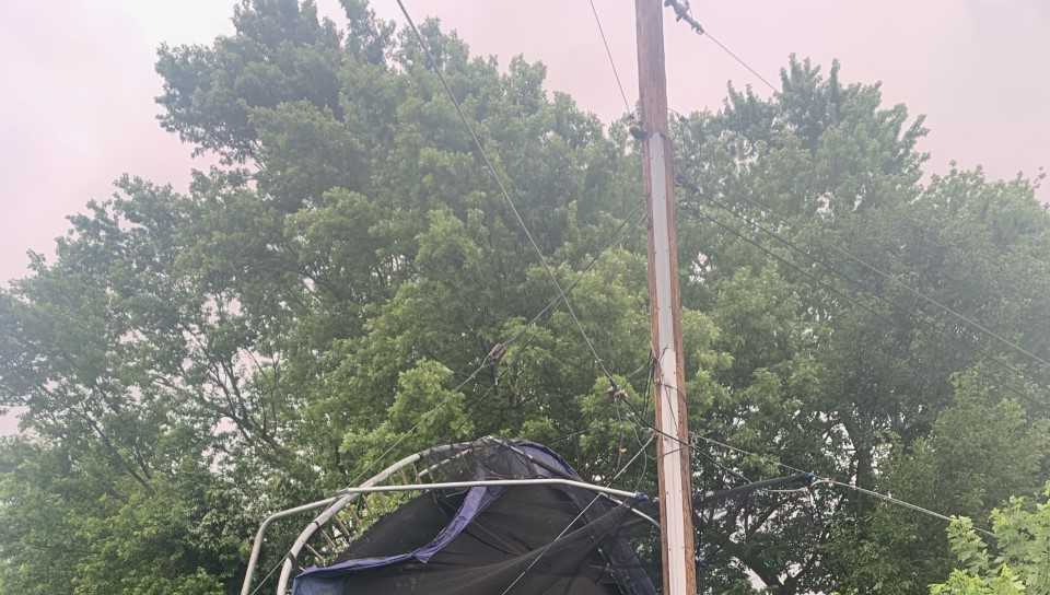 Trampoline caught in utility lines after overnight storms