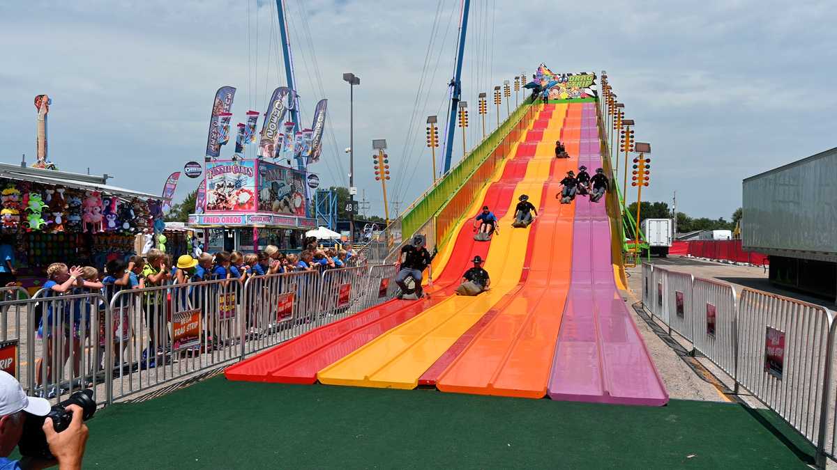 Nebraska State Fair fun: State troopers take ride on big slide